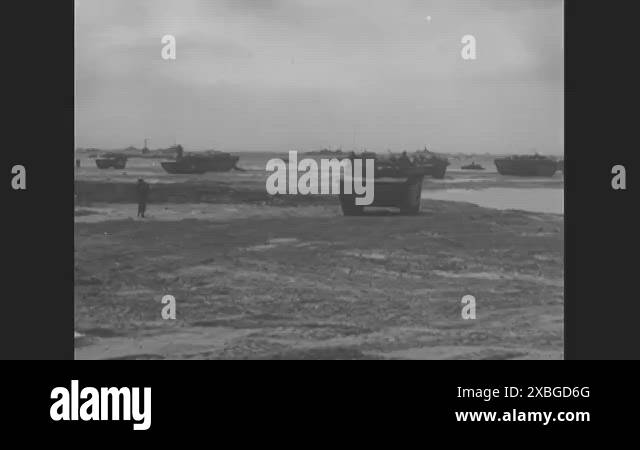 1945 - Amphibious landing craft on the beach of Okinawa, tractors ...