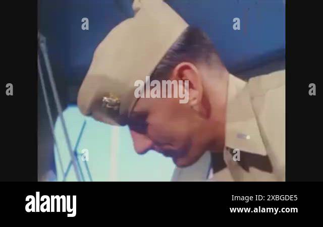 1968 - Two navy officers look over a map, and a Catapult Officer ...