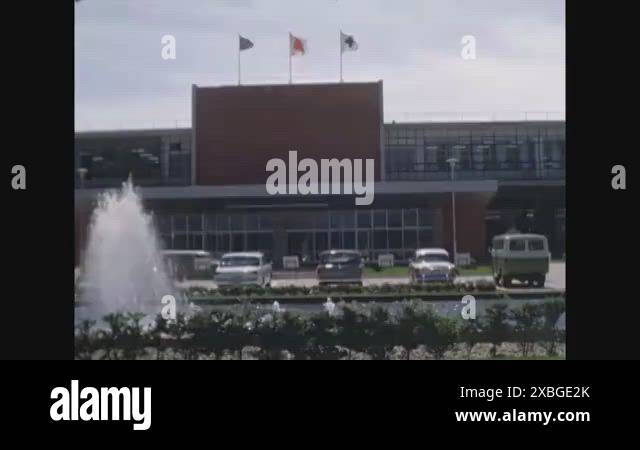1966 - The exterior of a Japanese industrial building with flags Stock ...