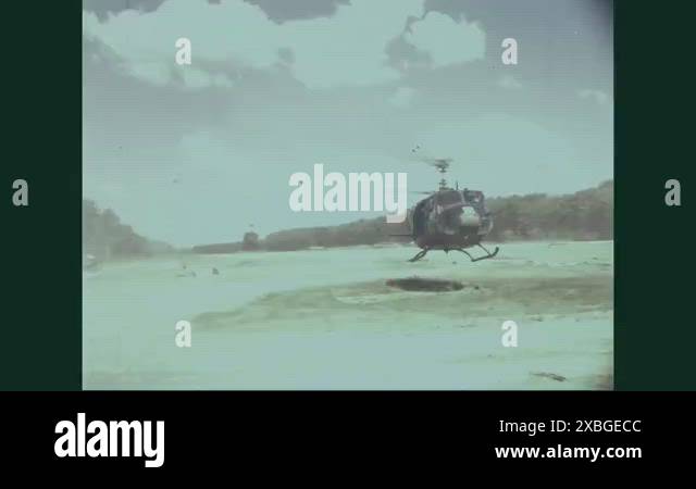 1965 - Helicopters land in Vietnam, and American soldiers load them up ...
