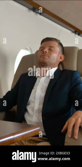 Attractive rich person businessman preparing his air seat in his own ...