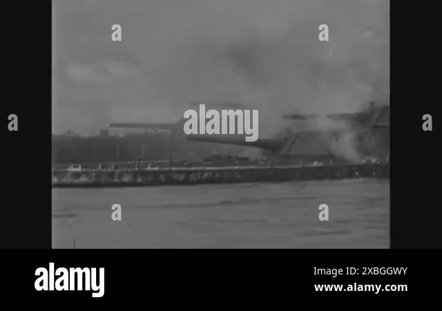 1941 - US Navy sailors use powerful hoses to put out burning ships after the Pearl Harbor attack ...