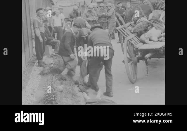 Piles of corpses are loaded onto wagons a the Mauthausen concentration ...