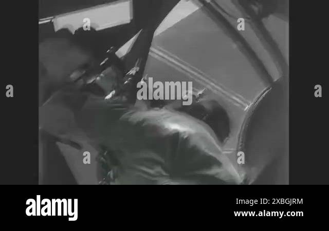 Gunner firing 50 cal machine gun from a US bomber plane, World War II ...