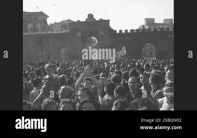 1944 - Civilians crowd St. John's Square in Rome, cheering as American ...