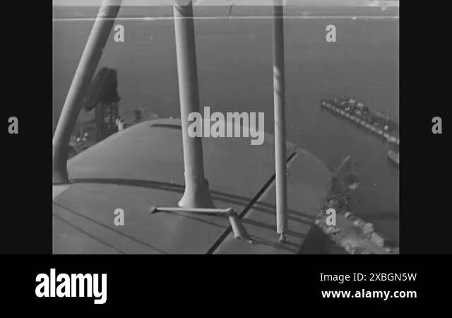 1930s - An aerial view shows US Navy ships, including the USS Ranger ...