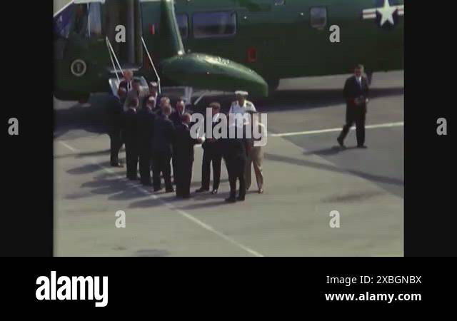 1963 - Rear Admiral Clark leads JFK to a speaking platform at Point ...