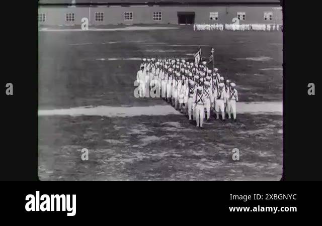 1943 - Recruits and the Color Guard march at the Naval Training Center ...