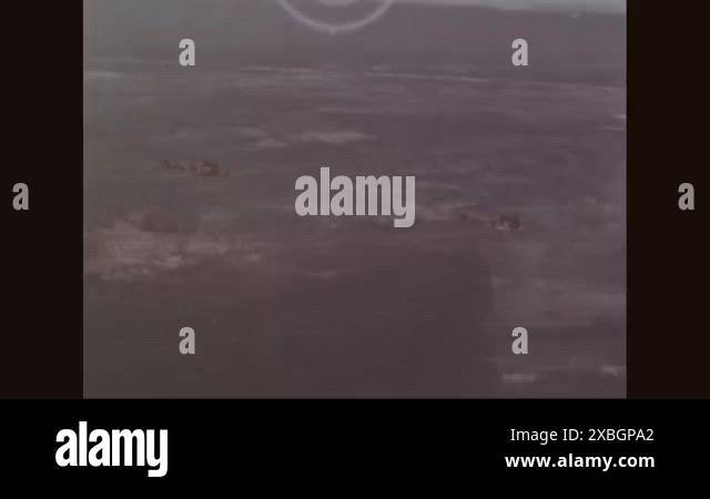 1968 - Aided by fighter planes, USAF helicopter pilots perform a rescue ...