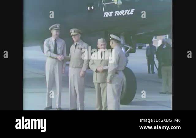 1946 - Rear Admiral Hardison, Captain Barbaro, and crewmen stand before and inspect the P2V ...
