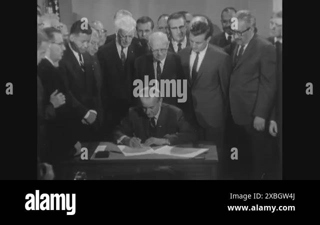 1968 - President Lyndon B. Johnson signs the Civil Rights Act and gives ...