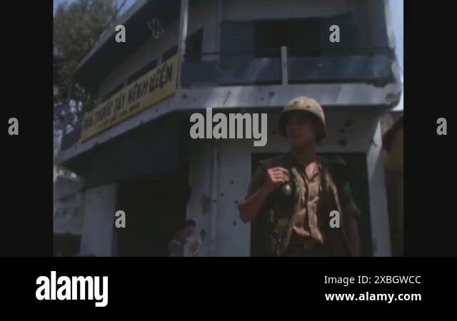 1968 - American and Vietnamese soldiers guard the rubble of Saigon ...