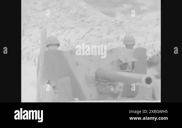 Chinese nationalist troops behind a 25mm howitzer, trenches and bunkers ...