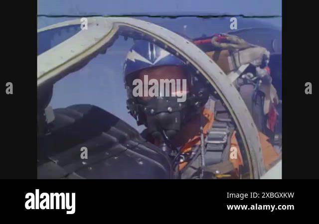 Close up of a pilot in the cockpit of his aircraft, canopy closed ...