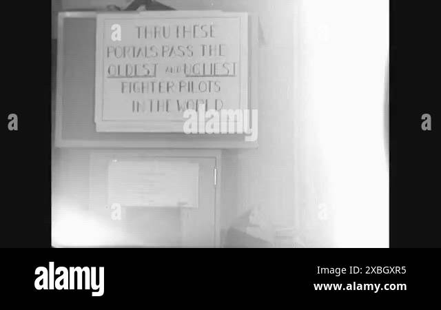 Pilots in the ready room of the USS Sicily, F4U's being pushed onto ...