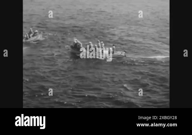 1939 - US Navy seamen on the USS Falcon and Sagamore work to recover ...