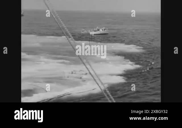 1939 - Rescue vessels raise the stern of the USS Squalus submarine ...