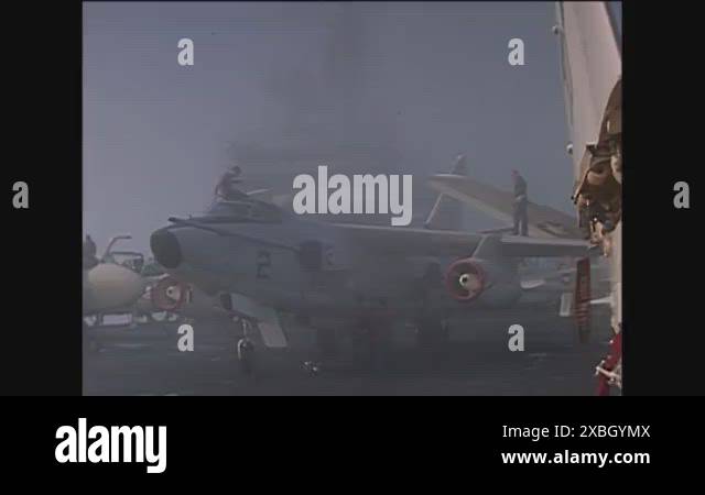 1969 - US Navy pilots check their planes on the flight deck of the USS ...