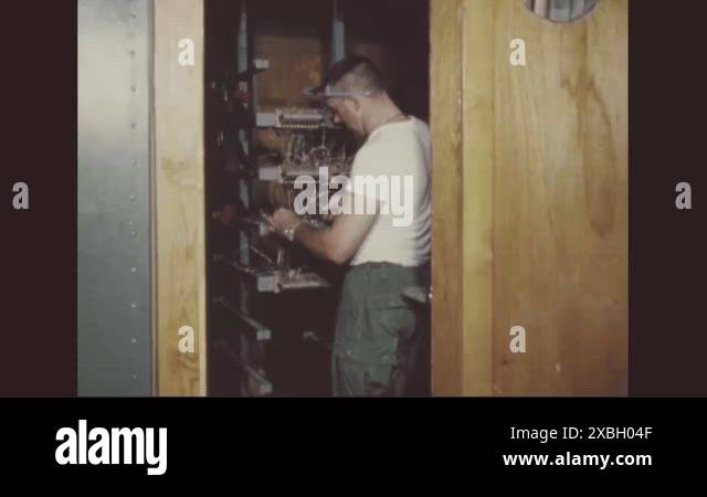 1969 - An American soldier wires a new circuit from a radio relay room ...
