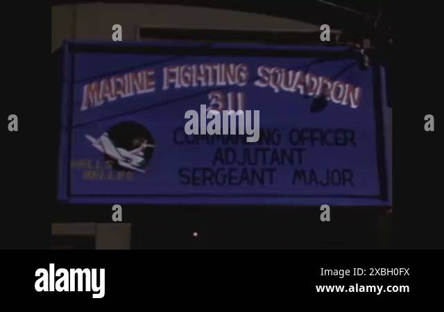 Marine Fighting Squadron 311 is shown as well as an explosion and fires ...