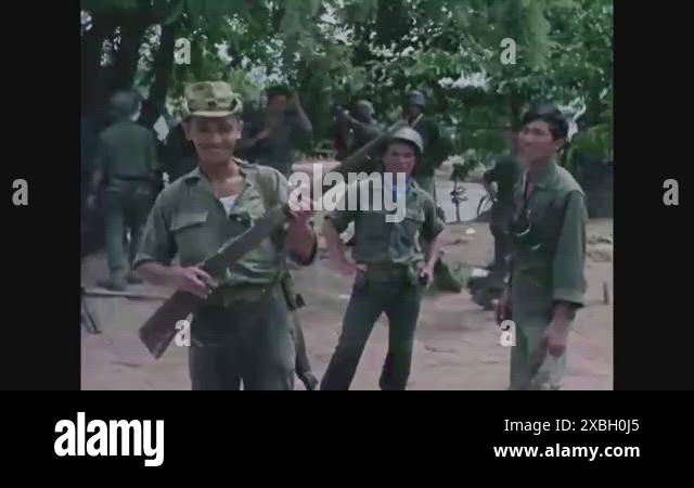 1962 - A Vietnamese soldier demonstrates the use of a captured Viet ...