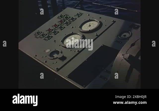 1970 - The control panels of the USS Van Voorhis are seen. A man ...