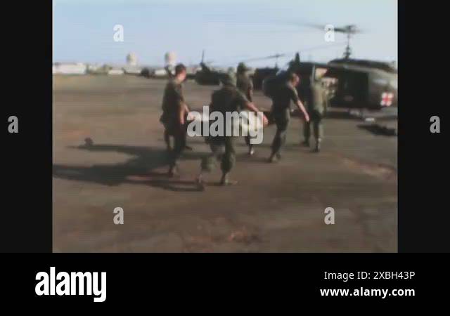 1968 - Wounded American soldiers are transferred from ambulances to ...