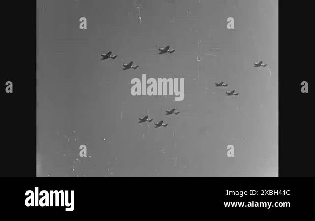 1942 - A US Navy signal officer directs planes to land on the USS ...