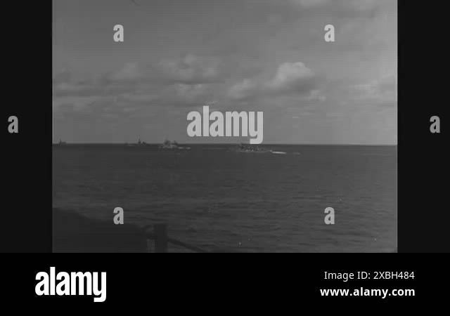 1942 - A US Navy task force is seen sailing in the Pacific at sunrise ...