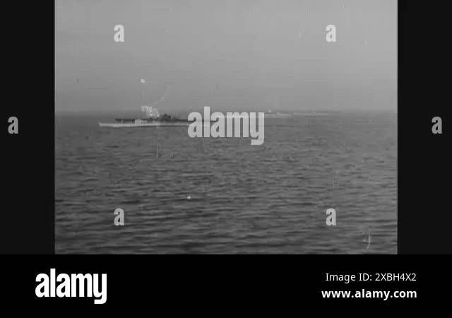 1940s - An aerial view shows US Navy submarines beginning to submerge ...