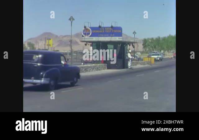 1963 - A sentry salutes cars as they enter the main gate of the Navy ...
