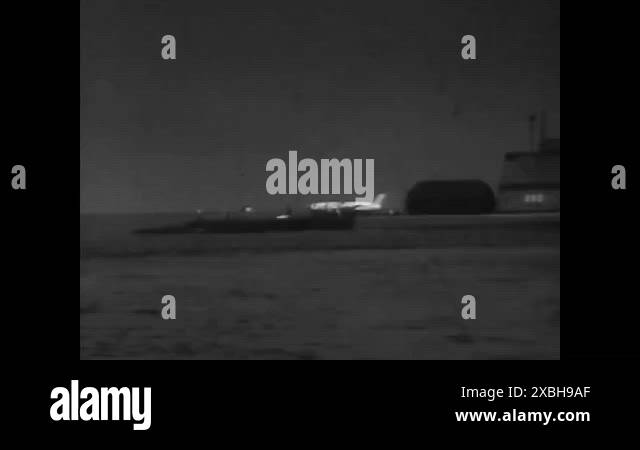 A missile is launched from a submarine and from a warship and fighter ...