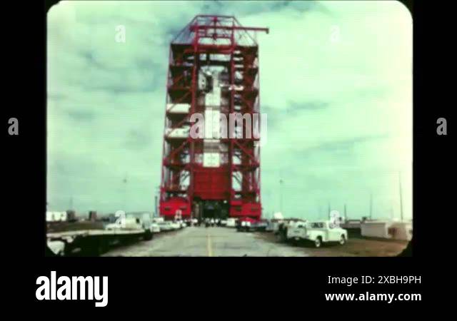 The Apollo 1 spacecraft is lowered onto a vehicle in the wake of a fire ...