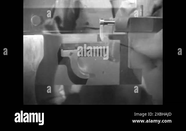 Cocking is demonstrated and a firing mechanism is shown on a United ...