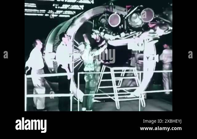 A thrust chamber is shown and an aft bulkhead assembly is mated to a ...