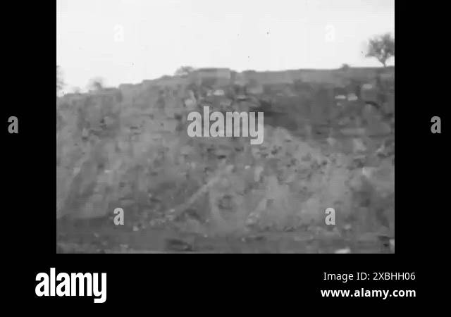 A cliffside explodes and a sample of limestone is shown and limestone ...
