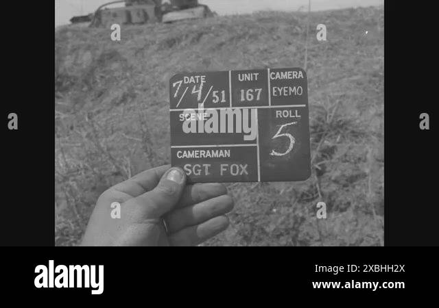 1951 - American soldiers duck in a ditch in Korea. A dying Korean baby ...
