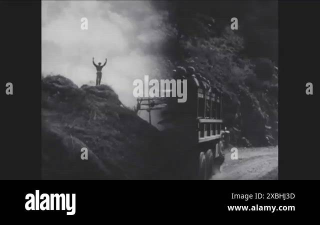 A back lineman runs telegraph lines atop a utility pole and the cavalry ...