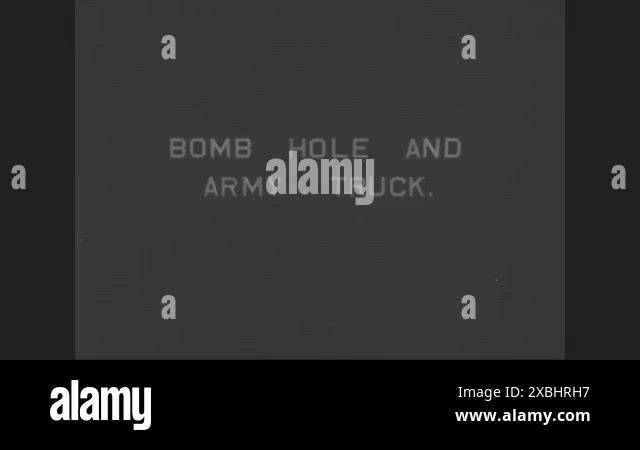 1942 - Remnants of bombed out vehicles and areas are shown after an ...