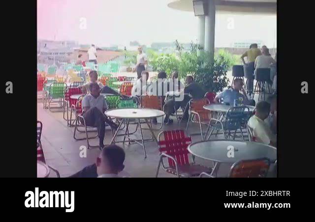 Off duty United States Army Rangers drink and smoke on a patio and a ...