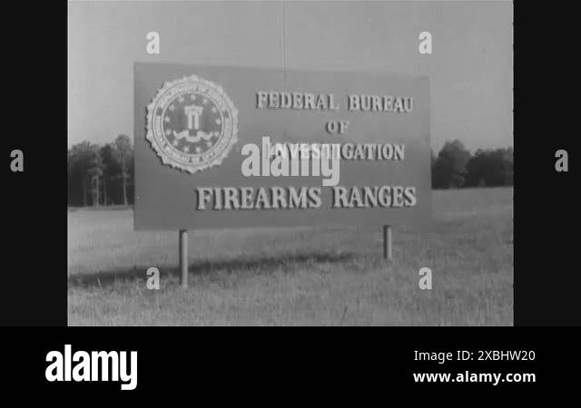 1960s - A policeman demonstrates some gun safety tips at a firing range ...