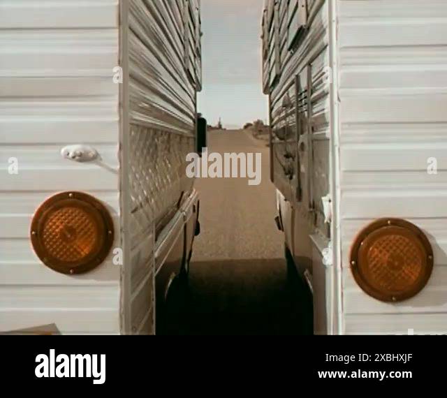 1965 - A cowboy driving a Chevy pickup camper beats a cowboy driving a ...