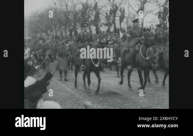 1918 - Crowds of Belgian civilians cheer on a passing military parade ...