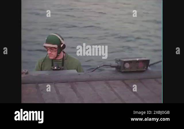 A control board operator and a catapult operator are shown as well as ...