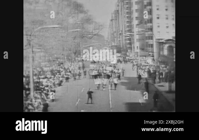 1967 - A crowd of pro-war citizens marches down a New York City street ...