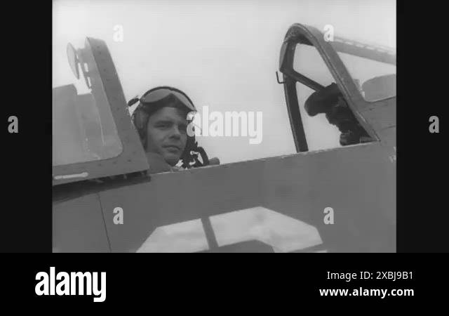 1950 - A US Navy pilot smiles at the camera from his cockpit before ...