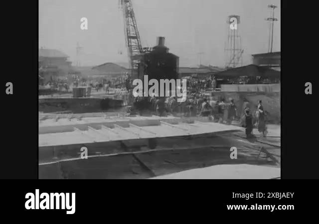 Workers arrive at a dry dock and shipbuilding company to repair ...