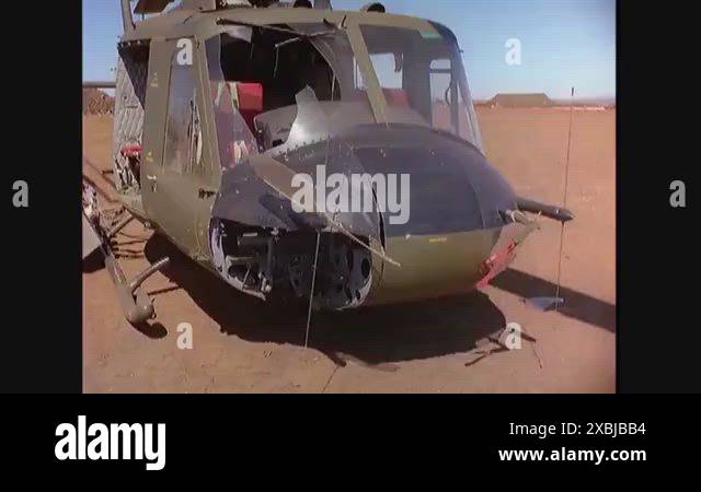 1965 - Wrecked helicopters and hand grenades are shown at Camp Holloway ...