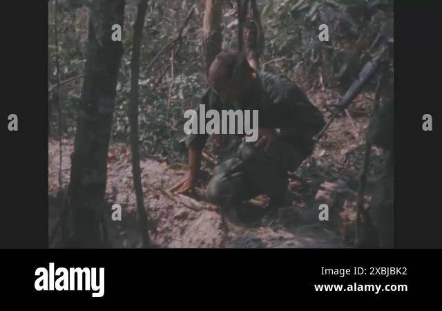 1969 - American soldiers inspect a Viet Cong bunker, and inspect the ...