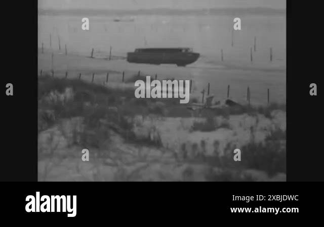 An amphibious landing craft is driven into and out of Chesapeake Bay at ...
